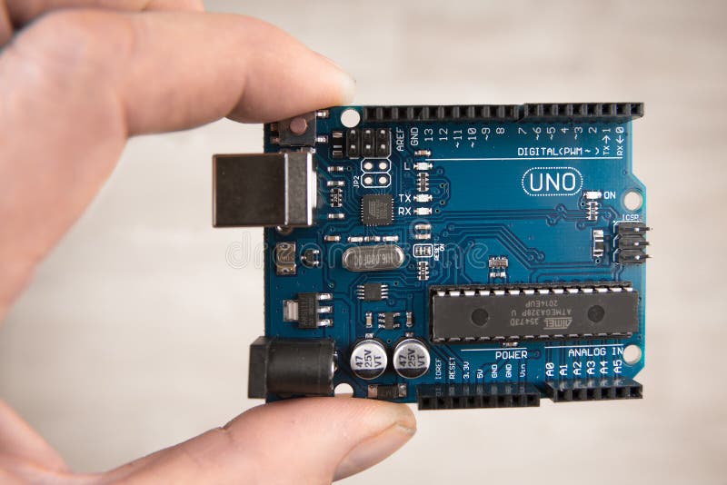 Arduino Uno Board Electronics In Hand For Programming The Microcontroller Editorial Image