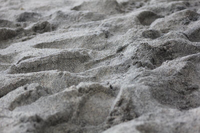 Arena De Fondo En La Playa De Arena Gris Como Fondo. Imagen de archivo ...