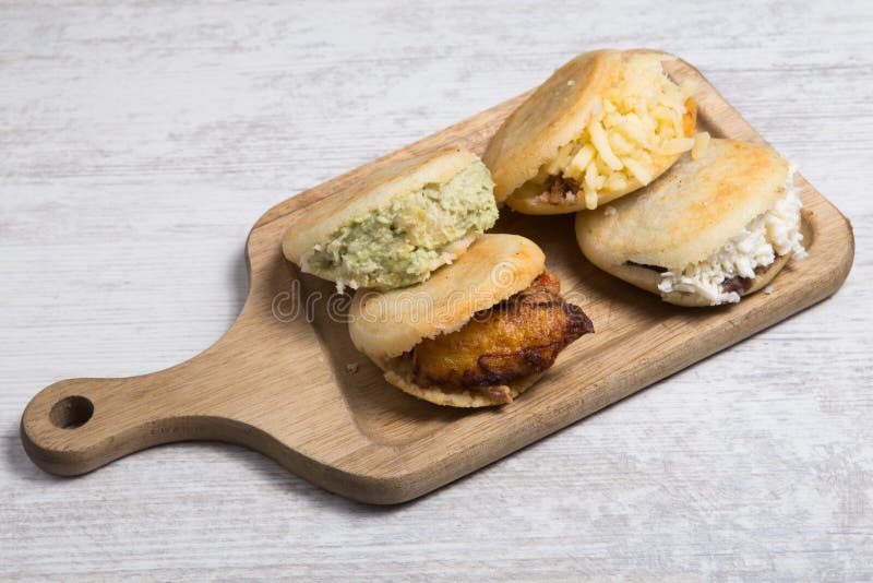 Assorted arepas on a plate stock photo. Image of dinner - 196150608