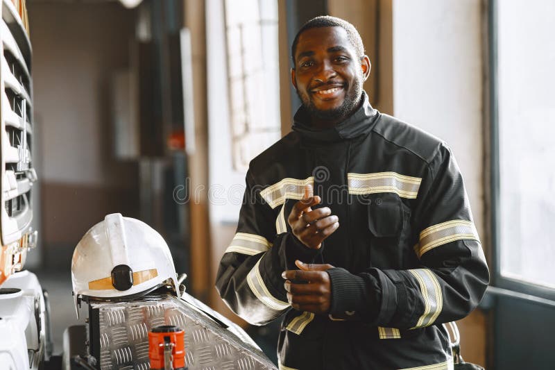 Portrait of a Firefighter Standing in Front of a Fire Engine Stock ...
