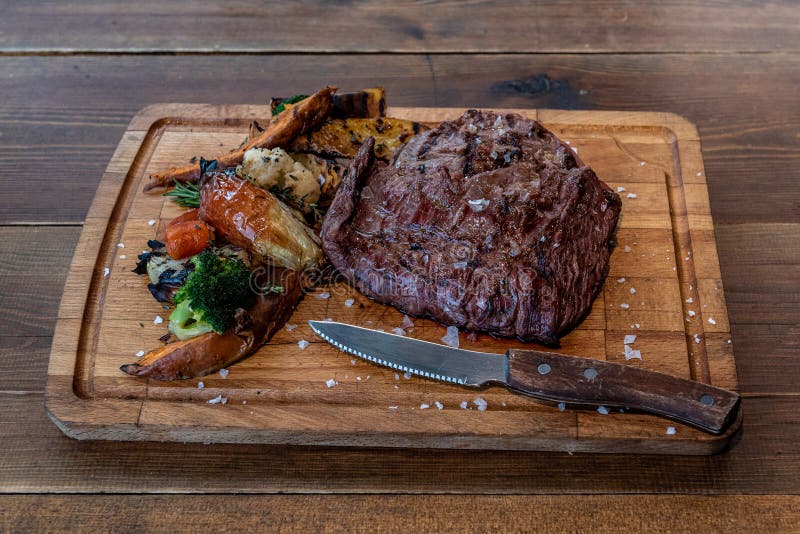 Argentine Cut of Meat Called Vacio with Chorizos and Chimichurri Stock ...