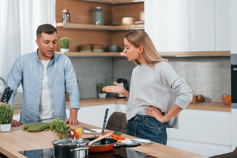 Arguing with Each Other. Couple Preparing Food at Home on the Modern ...