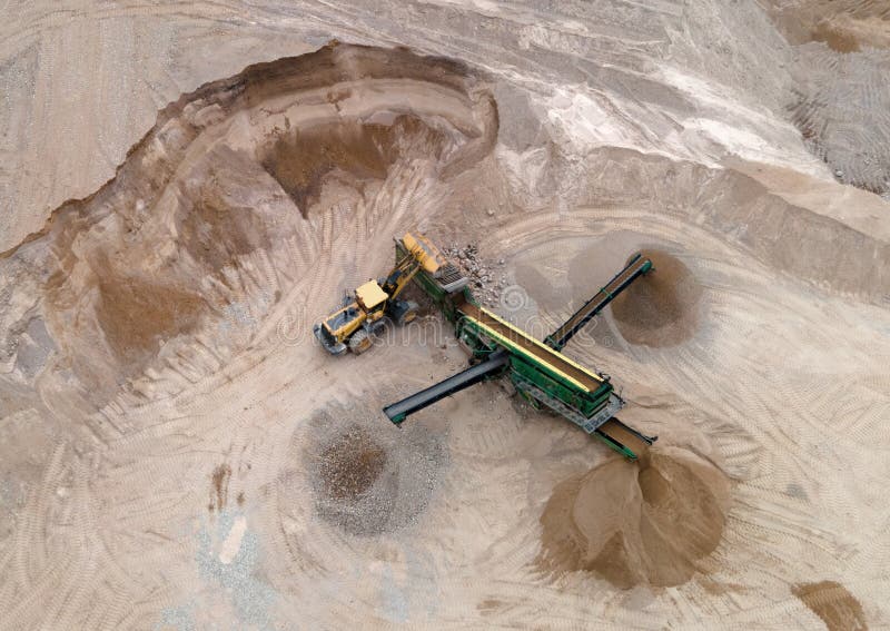 Arial View of the Open Pit Mine. Front End Loader Loading Gravel into ...