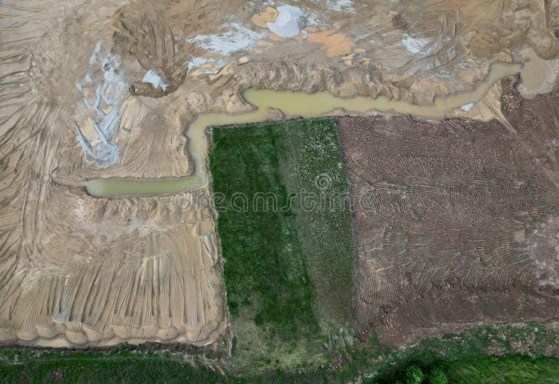 Arial View of Open Pit Sand Mine. a Front Loader Loads Sand from Piles ...