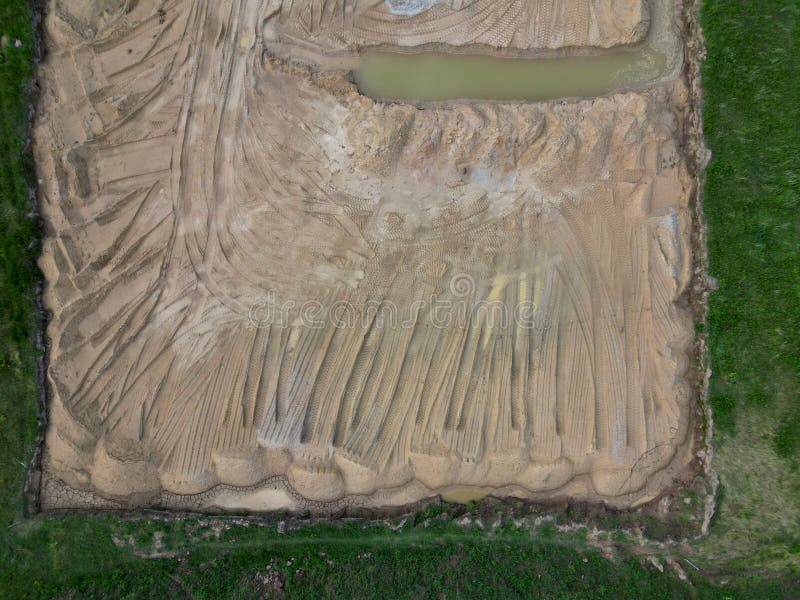 Arial View of Open Pit Sand Mine. a Front Loader Loads Sand from Piles ...