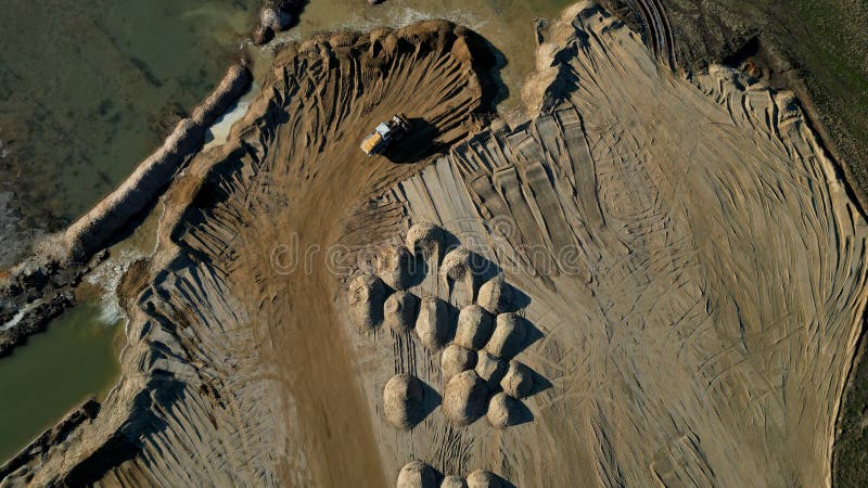 Arial View of Open Pit Sand Mine. a Front Loader Loads Sand from Piles ...
