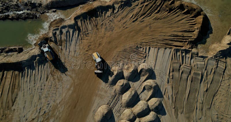 Arial View of Open Pit Sand Mine. a Front Loader Loads Sand from Piles ...