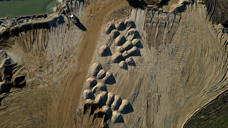Arial View of Open Pit Sand Mine. a Front Loader Loads Sand from Piles ...