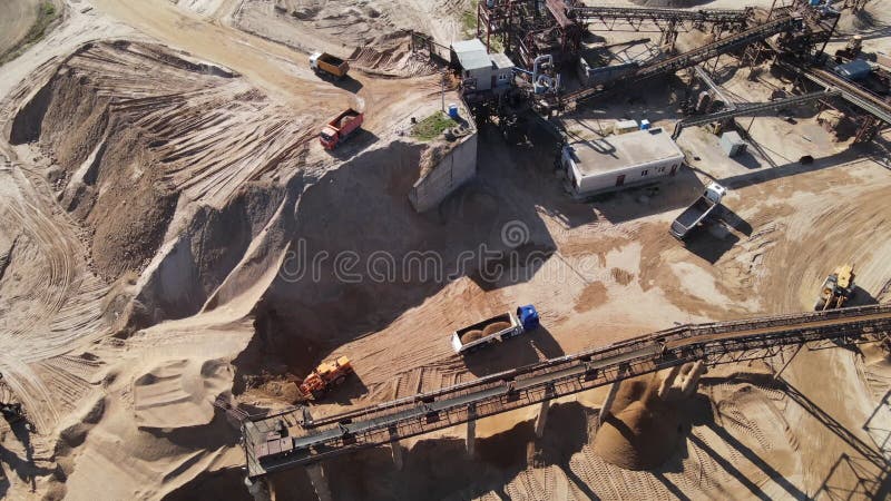 Wheel Loader Loading Sand into Dump Truck in Opencast Quarry. Truck ...