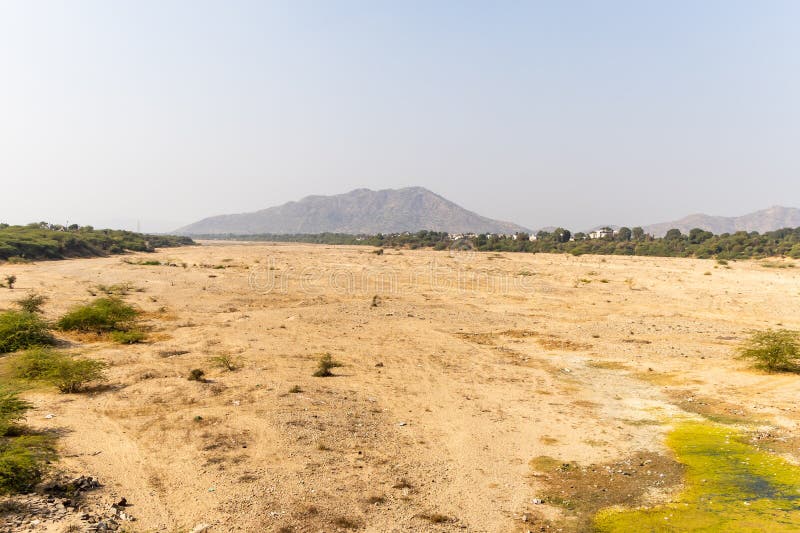 Arid Riverbed with Mountains in the Background Under Daylight Stock ...