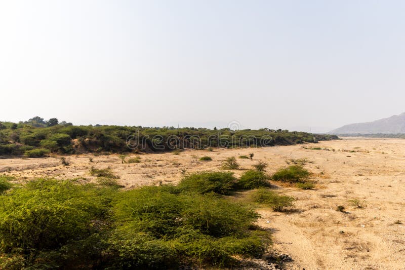Arid Riverbed with Mountains in the Background Under Daylight Stock ...