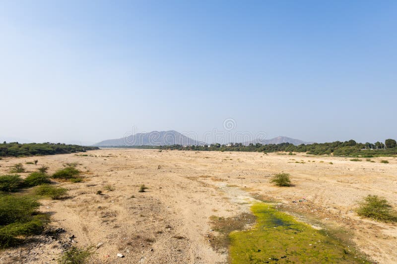 Arid Riverbed with Mountains in the Background Under Daylight Stock ...