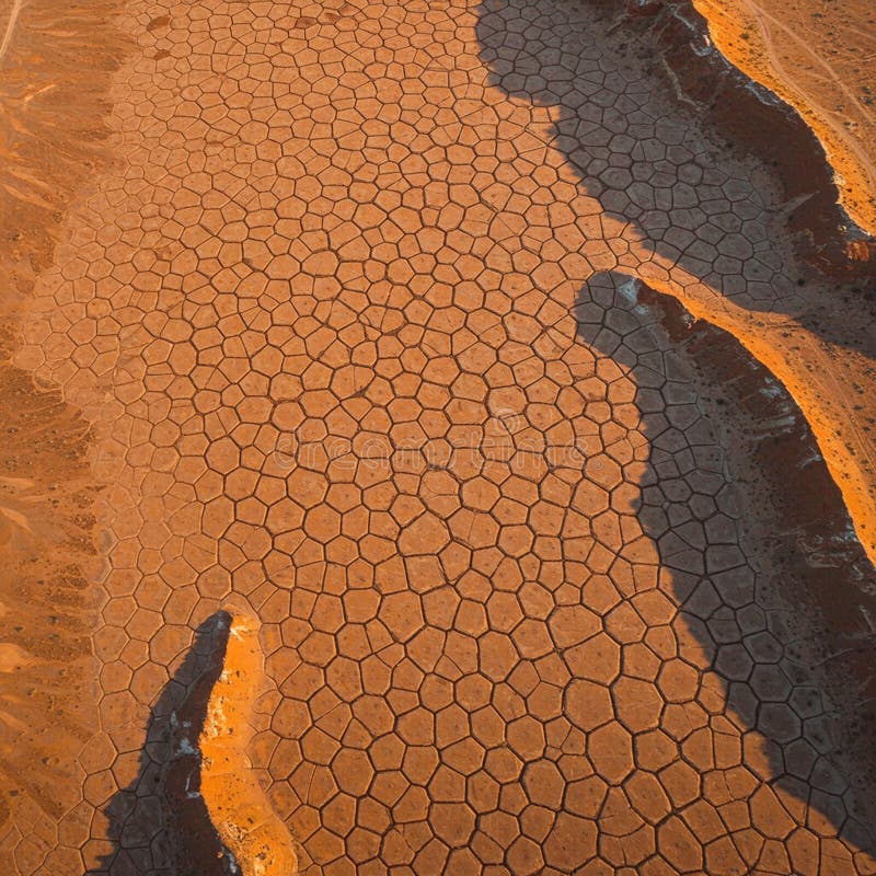 Arid Terrain Showcases a Striking Pattern of Hexagonal Clay Formations ...