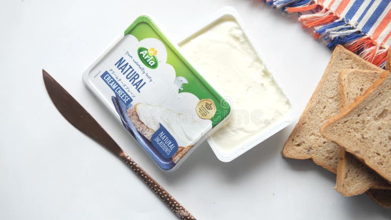 Arla Natural Low Fact Cheese Cream Spread on a Bread Stock Video ...