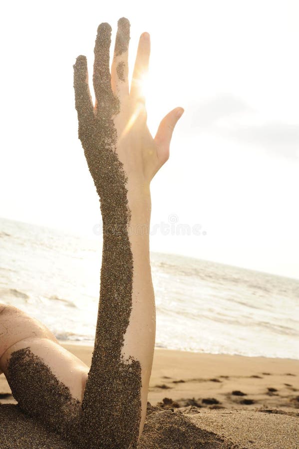 Arm Half Covered in Sand at the Beach Stock Image - Image of symbol ...