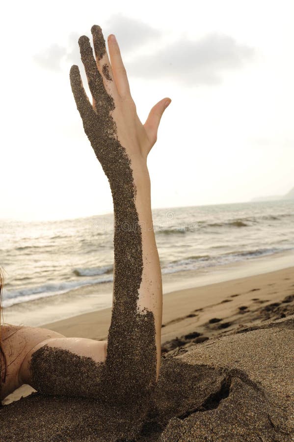 Arm Half Covered in Sand at the Beach Stock Image - Image of symbol ...