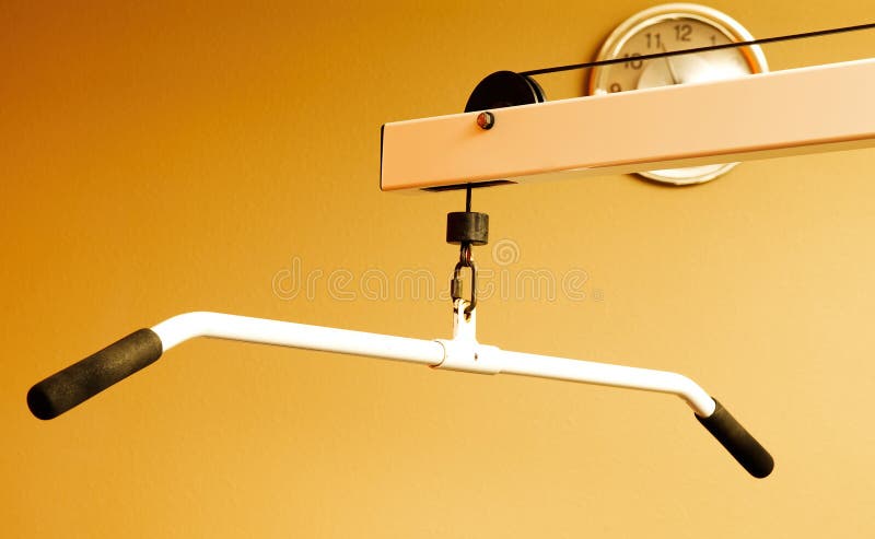 Arm and Handle for Exercising Machine with Yellow Wall Stock Image ...