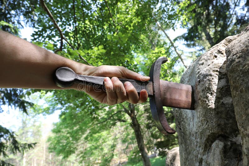 Arm of Man and the Sword in the Stone Stock Image - Image of britain ...
