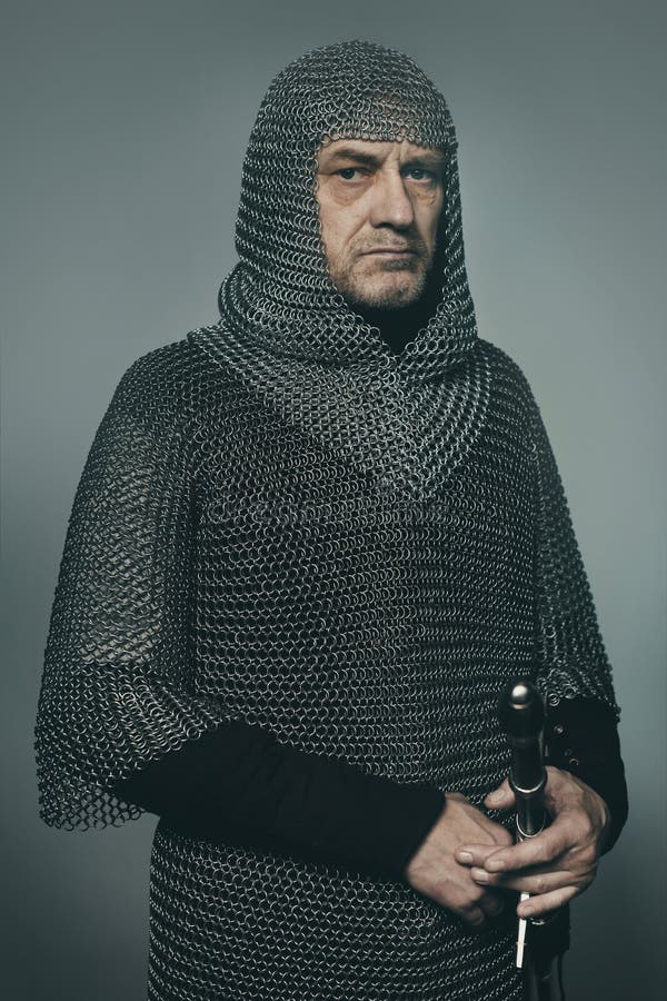 Armed Man in Chain Armor with Sword Posing for Portrait in Studio Stock ...