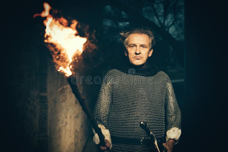 Armed Man in Chain Armor with Sword Serving As Guard at Night with ...