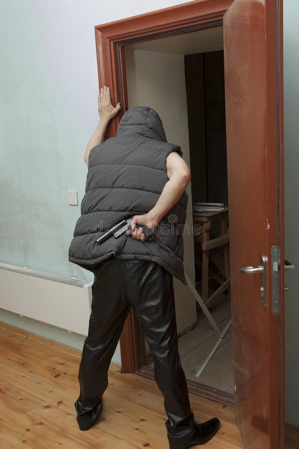 Armed Robber with a Gun in the Attic Stock Photo - Image of thug ...