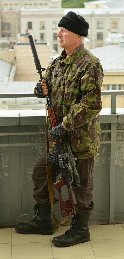 Armed man with weapon stock photo. Image of munitions - 42020460