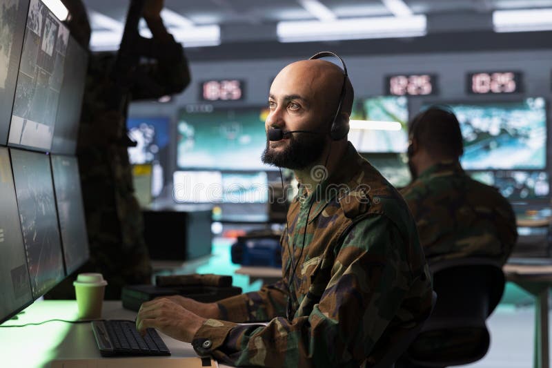 Army Dispatcher Relaying Data To Troops Using Headset Microphone Stock ...