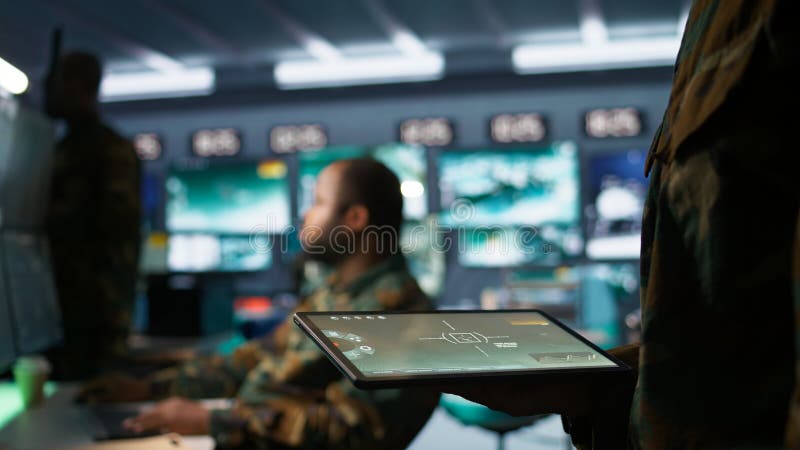 Army Operative Using Tablet To Intercept Ballistic Rockets Stock Photo ...