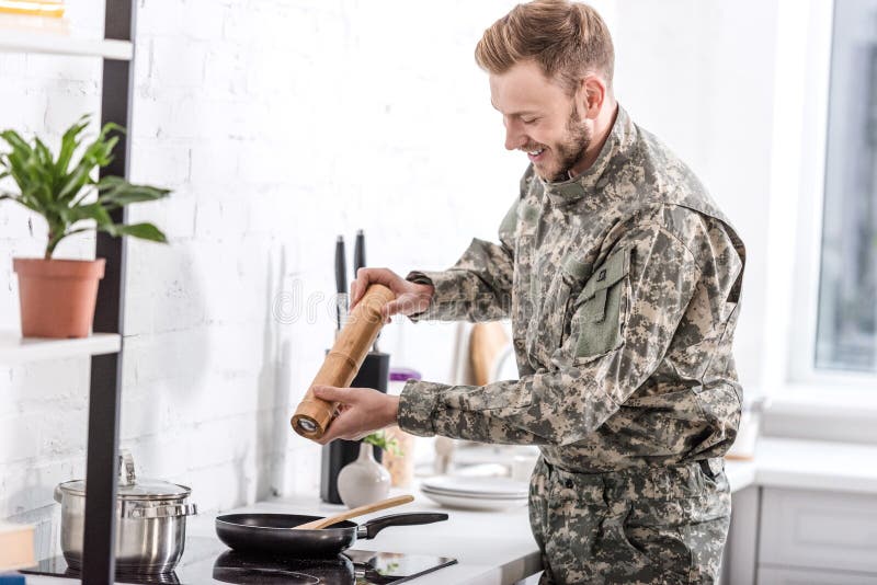 Army Soldier Using Pepper Pot while Cooking Stock Photo - Image of ...