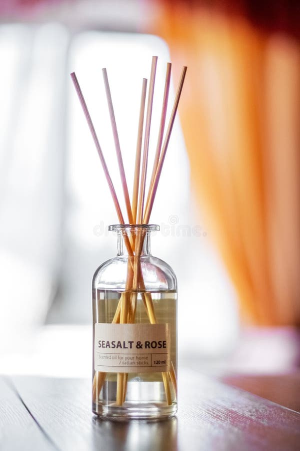 An Aroma Diffuser with Aromatic Oil and Sticks in the Room Creates an ...