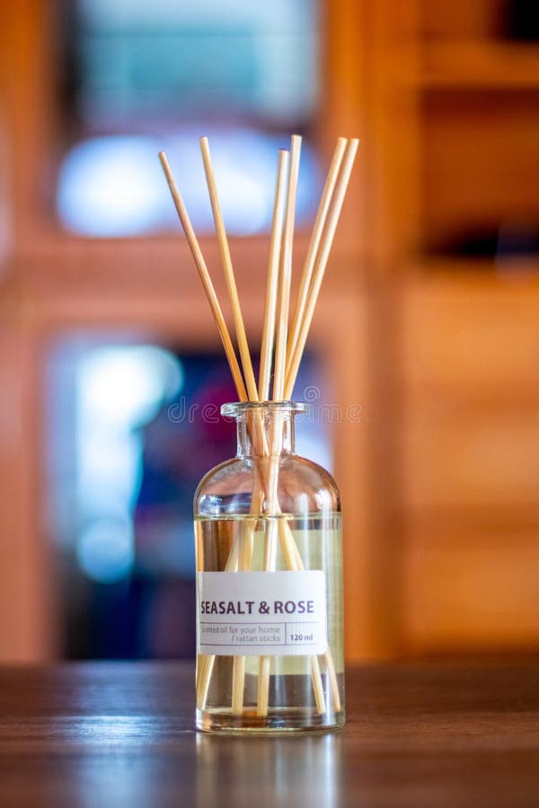 An Aroma Diffuser with Aromatic Oil and Sticks in the Room Creates an ...