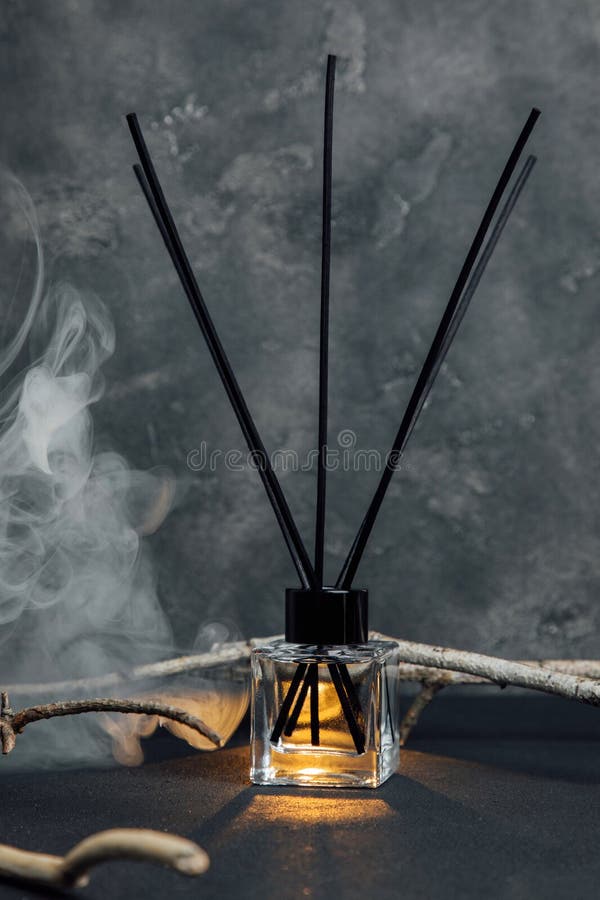 Aroma Diffuser in a Clear Glass Bottle with Black Cap on a Dark ...