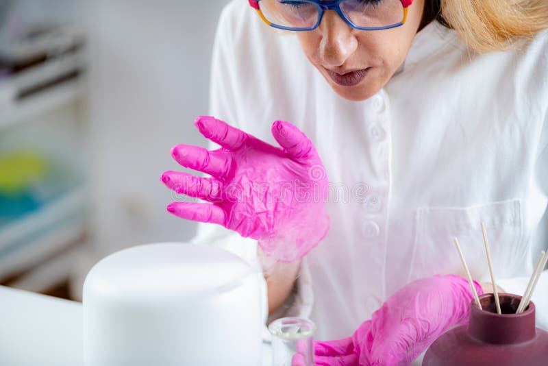 Aroma Diffuser in a Lab, Olfactory Science Technician Smelling the ...