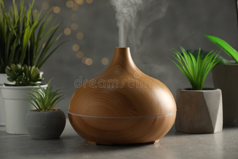 Aroma Oil Diffuser Steam Light Grey Table Stock Photos - Free & Royalty ...