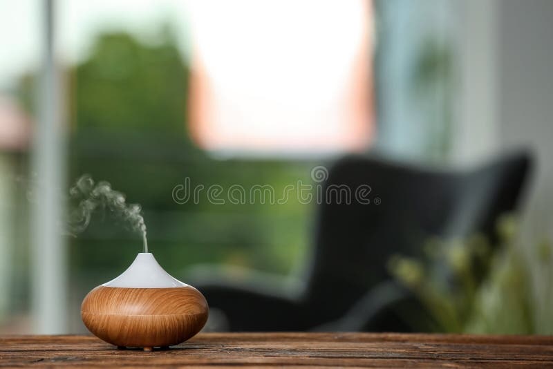 Aroma Oil Diffuser on Table at Home Stock Photo - Image of design ...