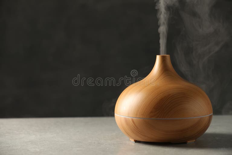 Aroma Oil Diffuser with Steam on Light Grey Table, Space for Text Stock ...