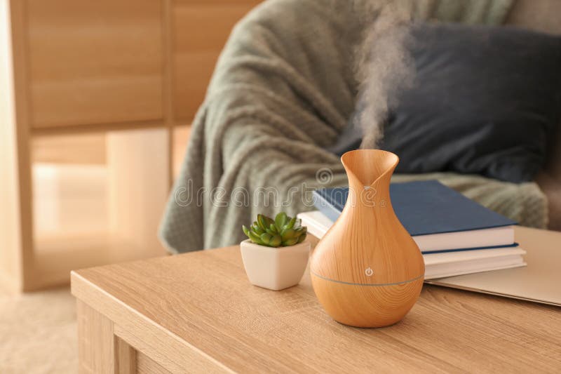 Aroma Oil Diffuser on Table in Room Stock Photo - Image of perfume ...