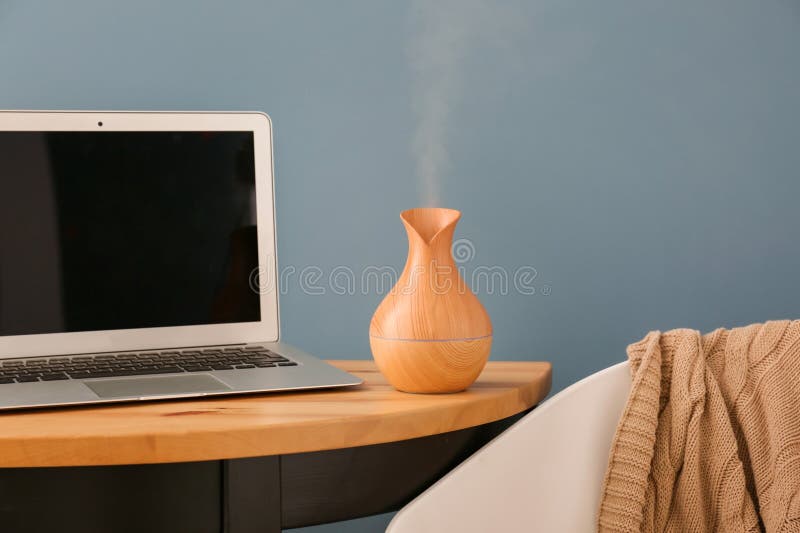 Aroma Oil Diffuser on Table in Room Stock Photo - Image of office ...
