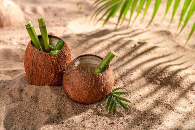 Aromatic Coconut Milk in Shell on an Exotic Beach Stock Photo - Image ...
