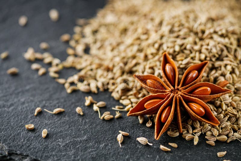 Aromatic Dry Anise Seeds on a Dark Black Stone Background Stock Photo ...