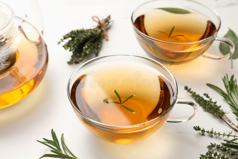 Aromatic Herbal Tea with Thyme and Rosemary on White Marble Table Stock ...
