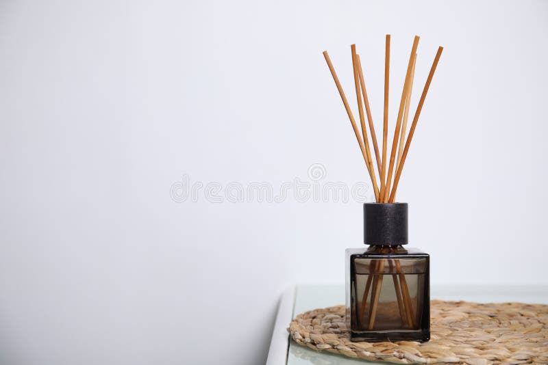 Aromatic Reed Freshener on Table Near White Wall, Space for Text Stock ...