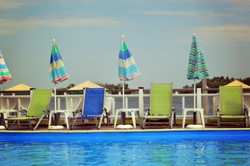 Around the pool stock image. Image of relax, umbrellas - 83834837