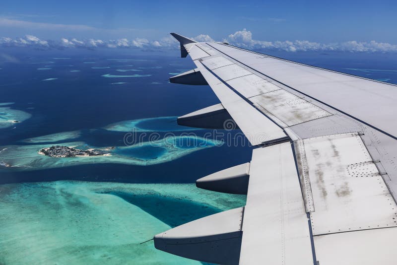 Arplane fly over Atolls stock photo. Image of pristine - 60486578