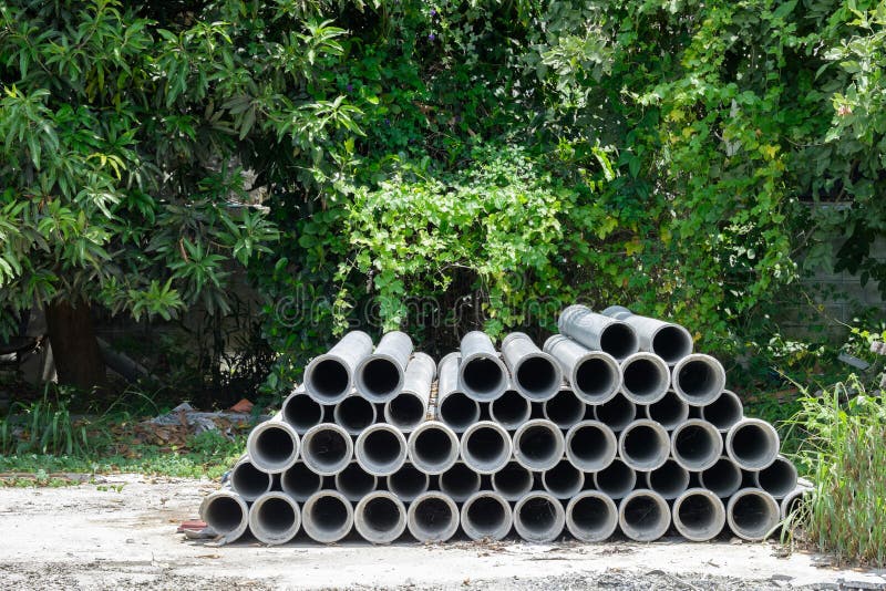 Arrange of cement pipe stock photo. Image of ditch, green - 57123906