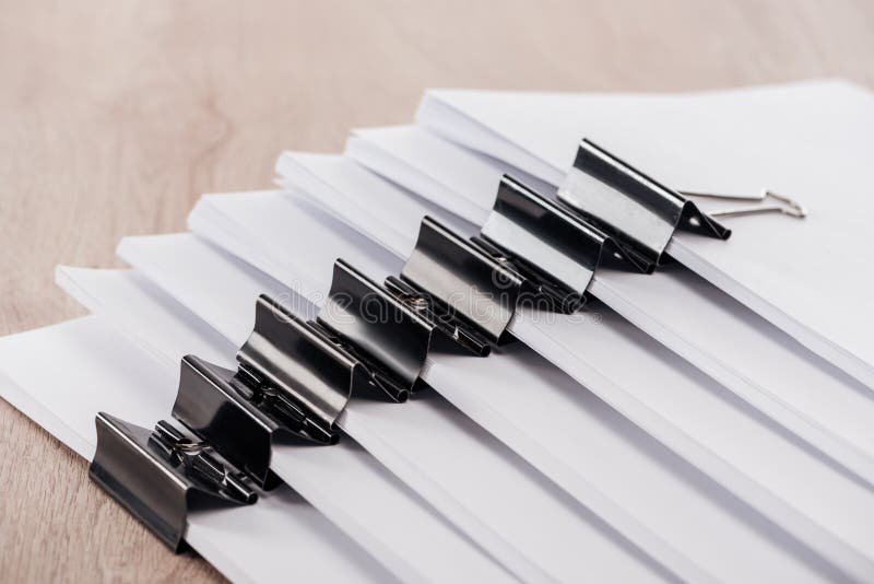 Arranged Stacks of Blank Paper with Metal Binder Clips on Table. Stock ...