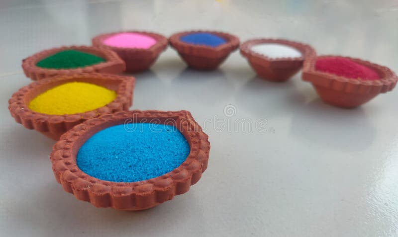 Arrangement of Beautiful Rangoli Colors on White Floor. Stock Image ...