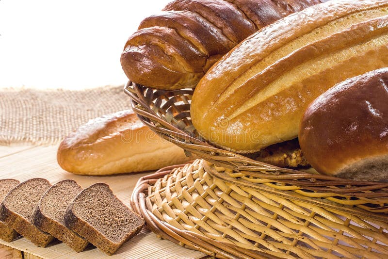 Arrangement of Bread in Basket on Wooden Table Stock Image - Image of ...