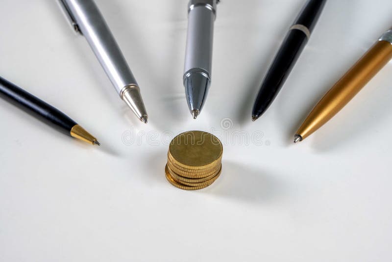 Arrangement of Pen and Gold Coin Stack Stock Photo - Image of ...