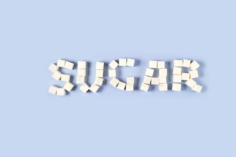 Arrangement of White Sugar Cubes Forming the Word Sugar on Light Blue ...